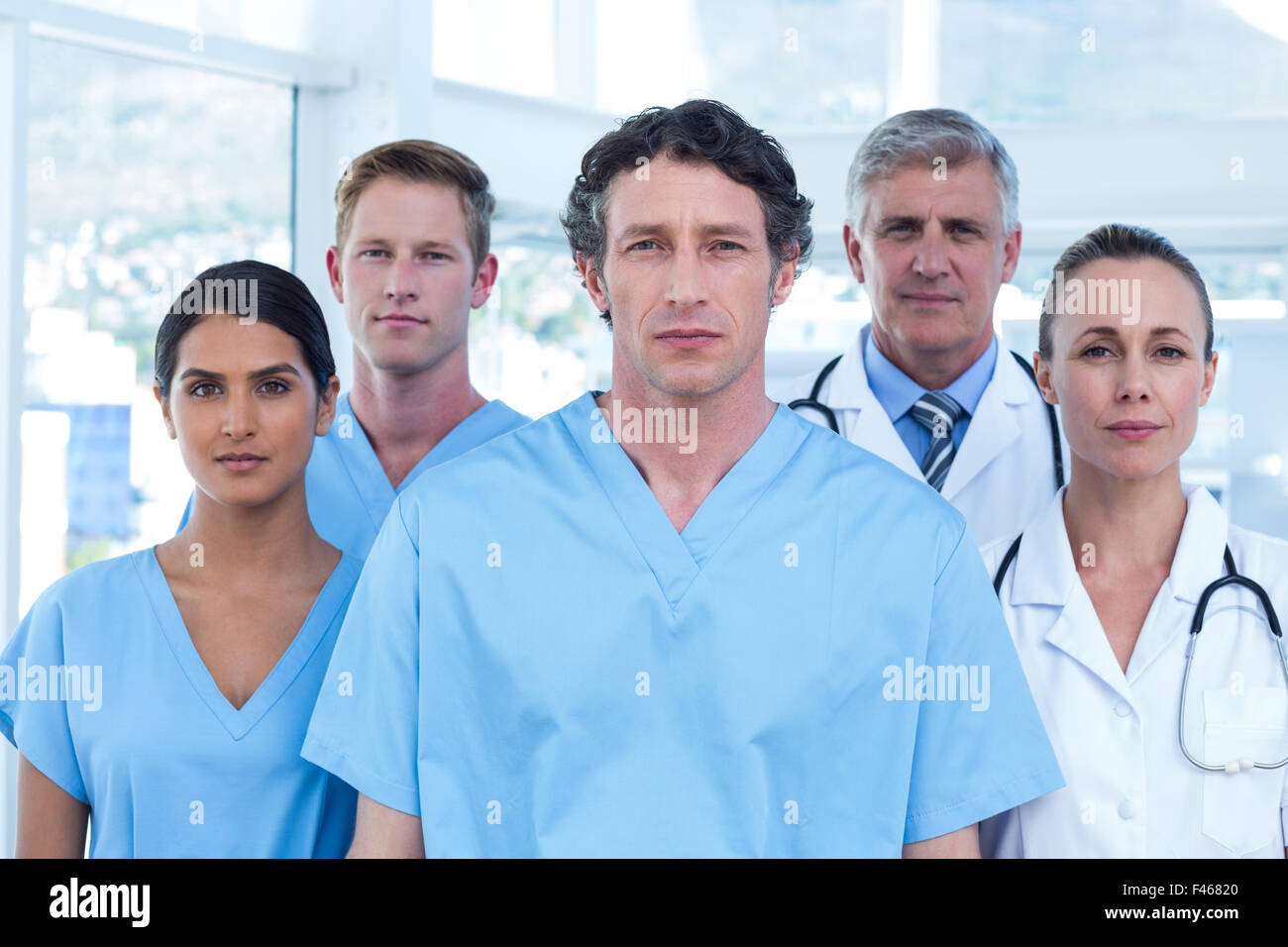 Team of serious doctors looking at camera Stock Photo - Alamy