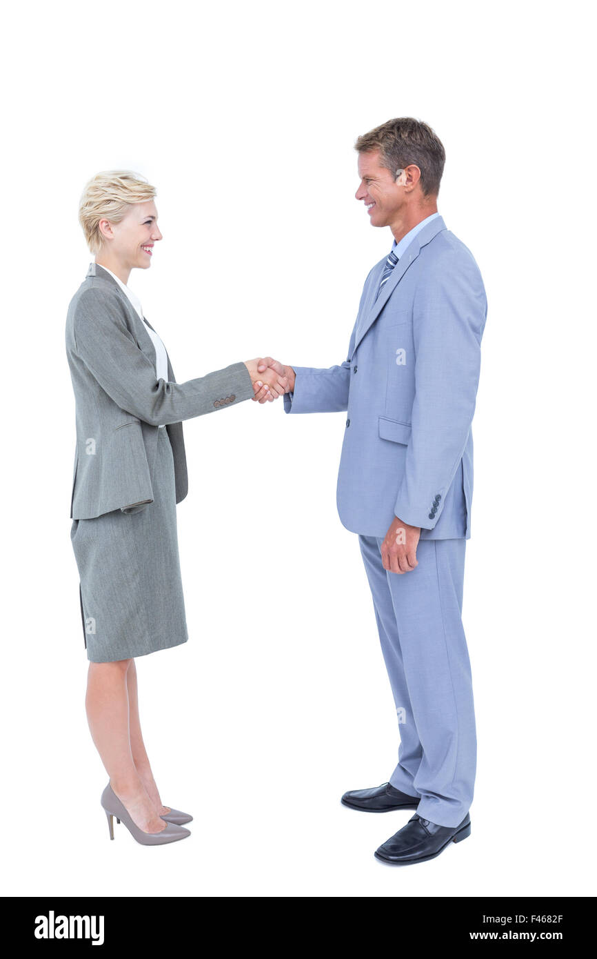Smiling business people shaking hands Stock Photo - Alamy