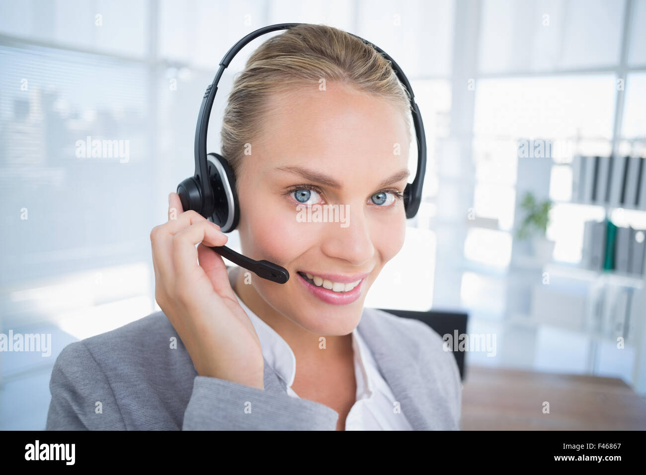 Businesswoman wearing a work headset Stock Photo - Alamy
