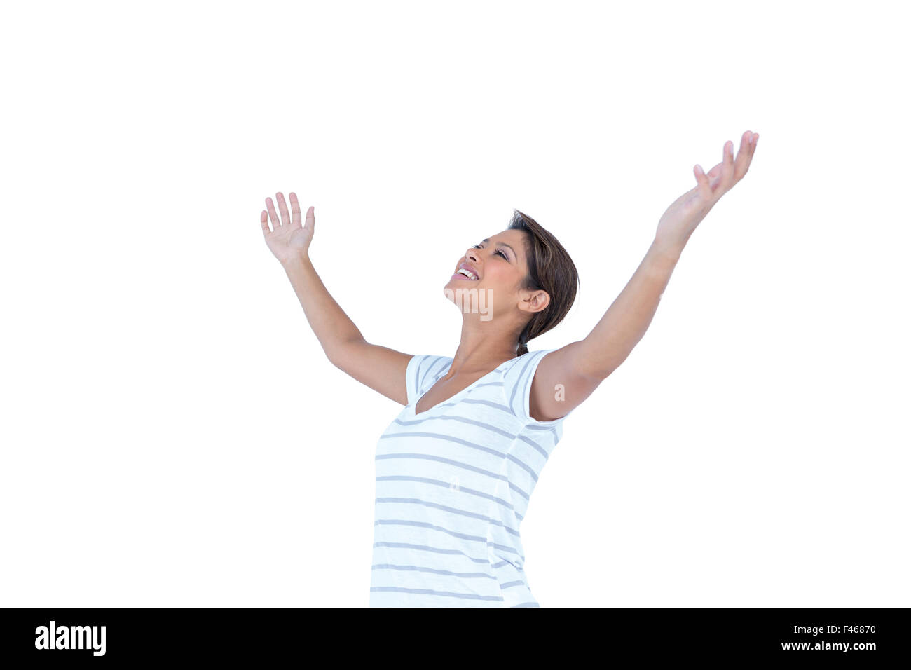 Happy brunette raising her arms Stock Photo - Alamy