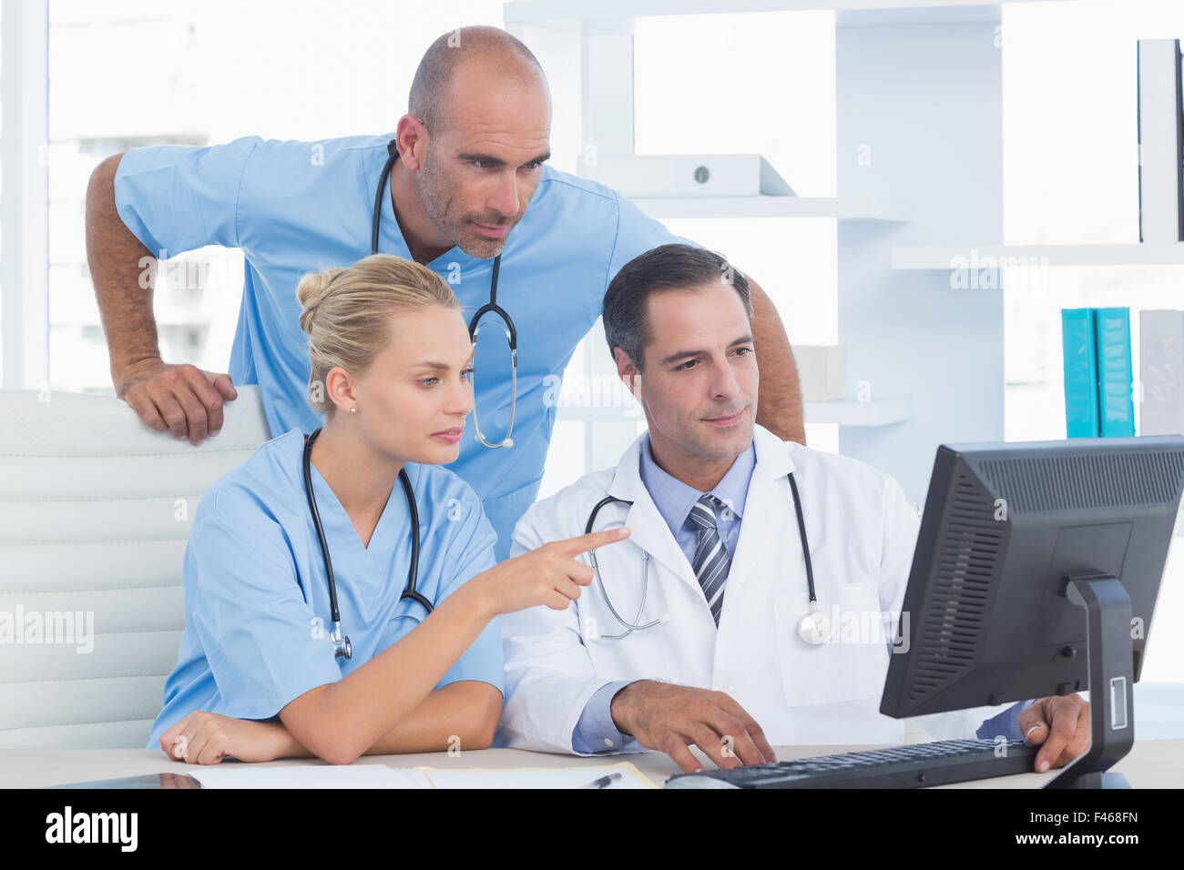 Doctors and surgeon working with computer Stock Photo - Alamy