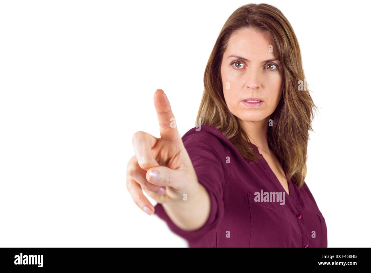 Serious woman pointing camera hi-res stock photography and images - Alamy