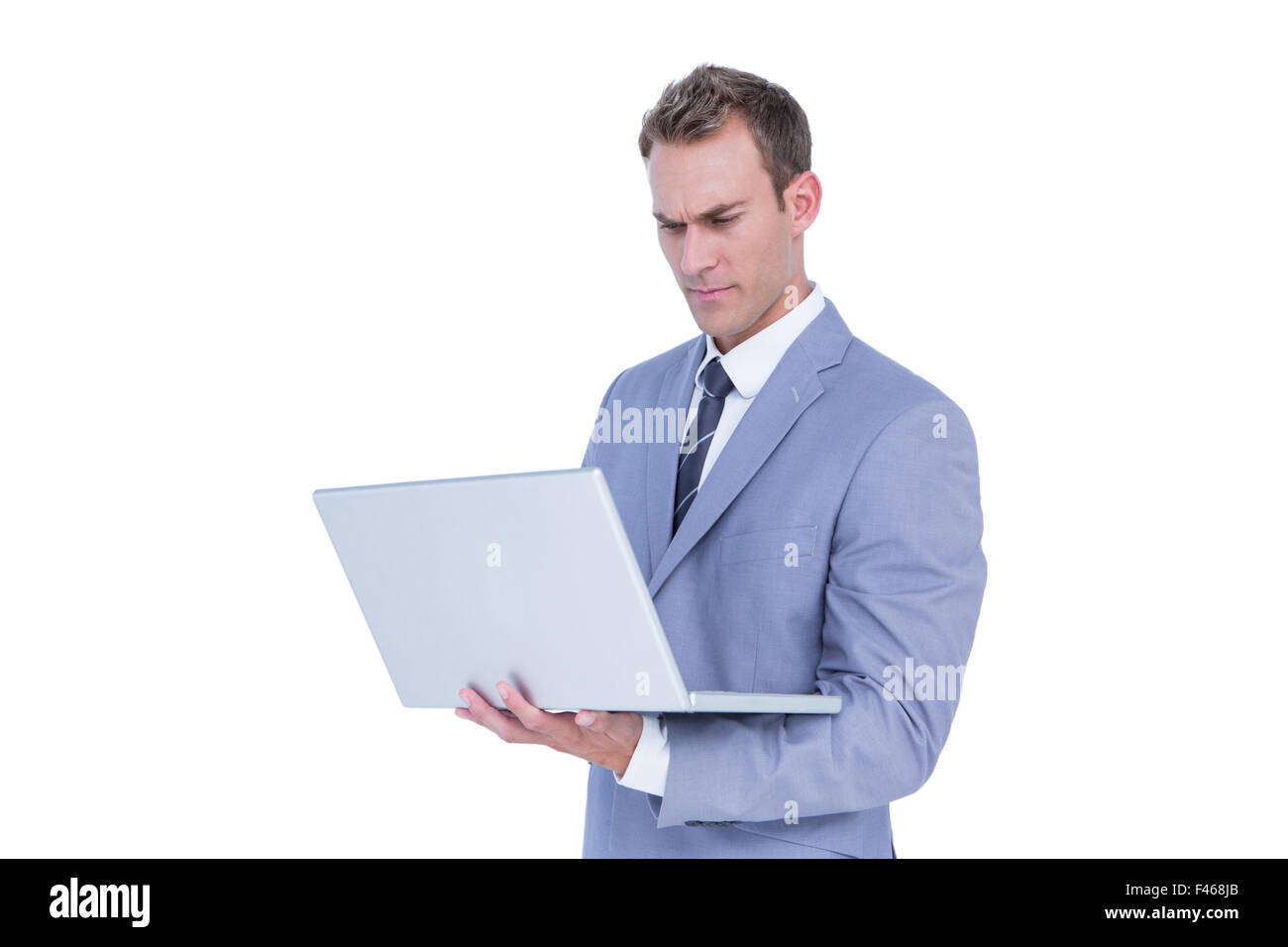 Handsome businessman using laptop computer Stock Photo - Alamy