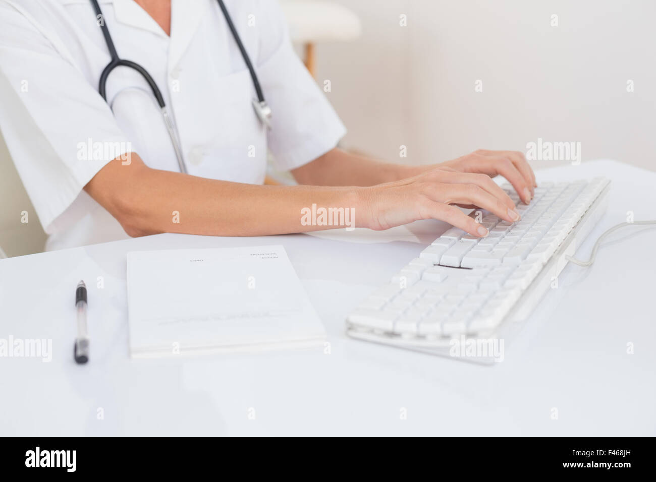 Doctor using computer Stock Photo - Alamy