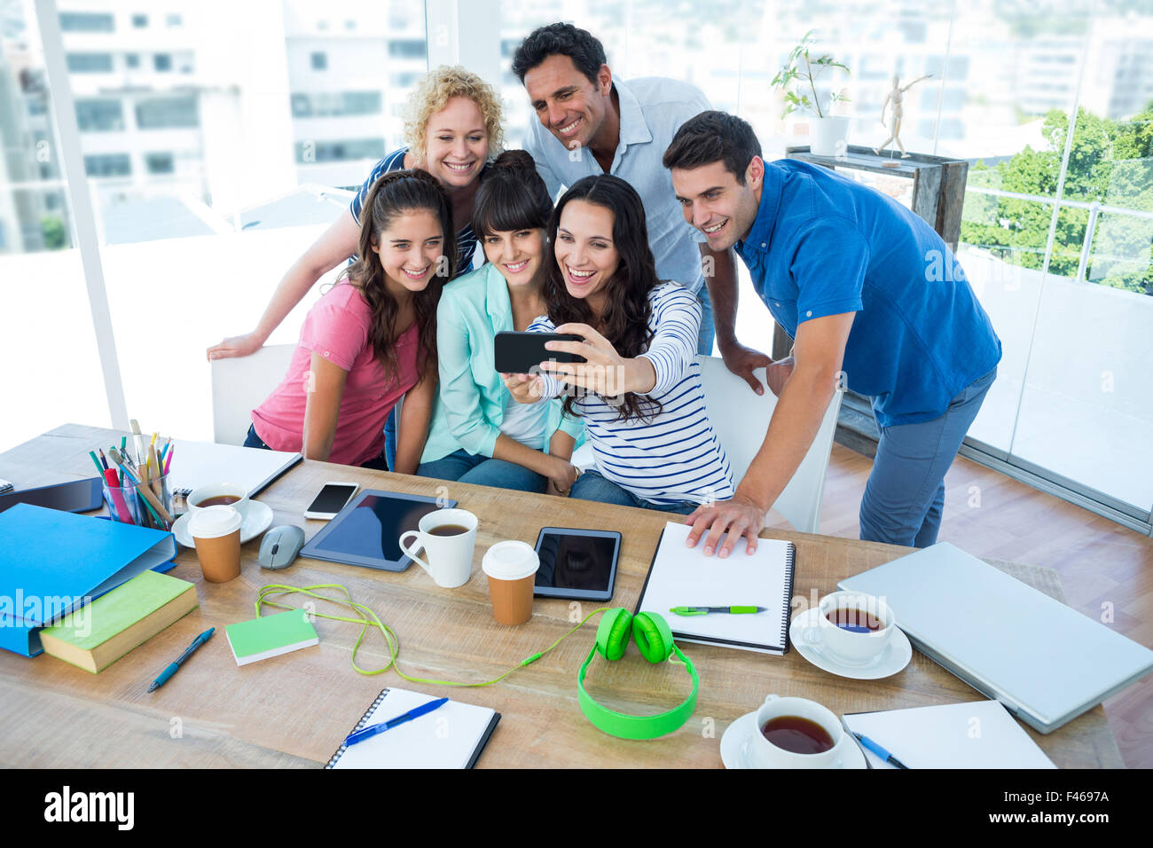 Creative business team taking a selfie Stock Photo - Alamy