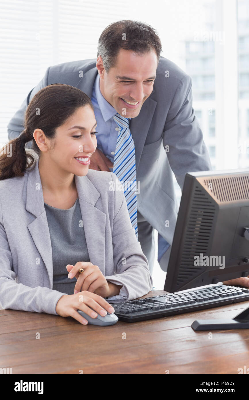 Smiling business partners working together Stock Photo - Alamy