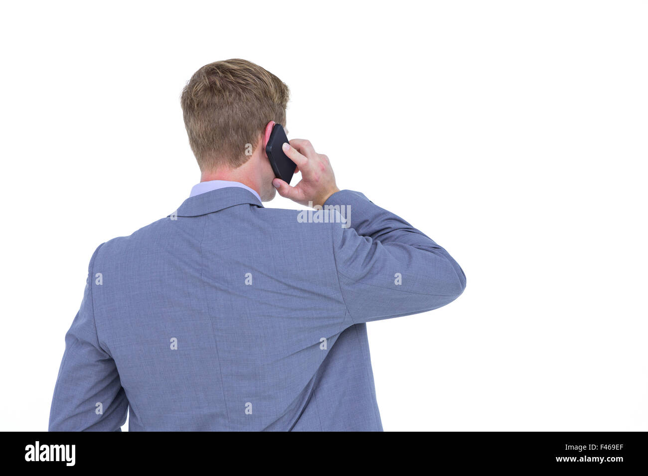 Back turned businessman on the phone Stock Photo - Alamy
