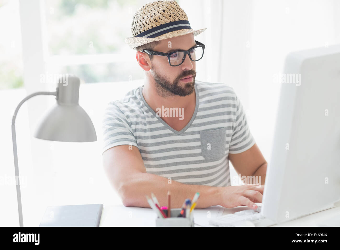 Serious handsome man typing hi-res stock photography and images - Alamy