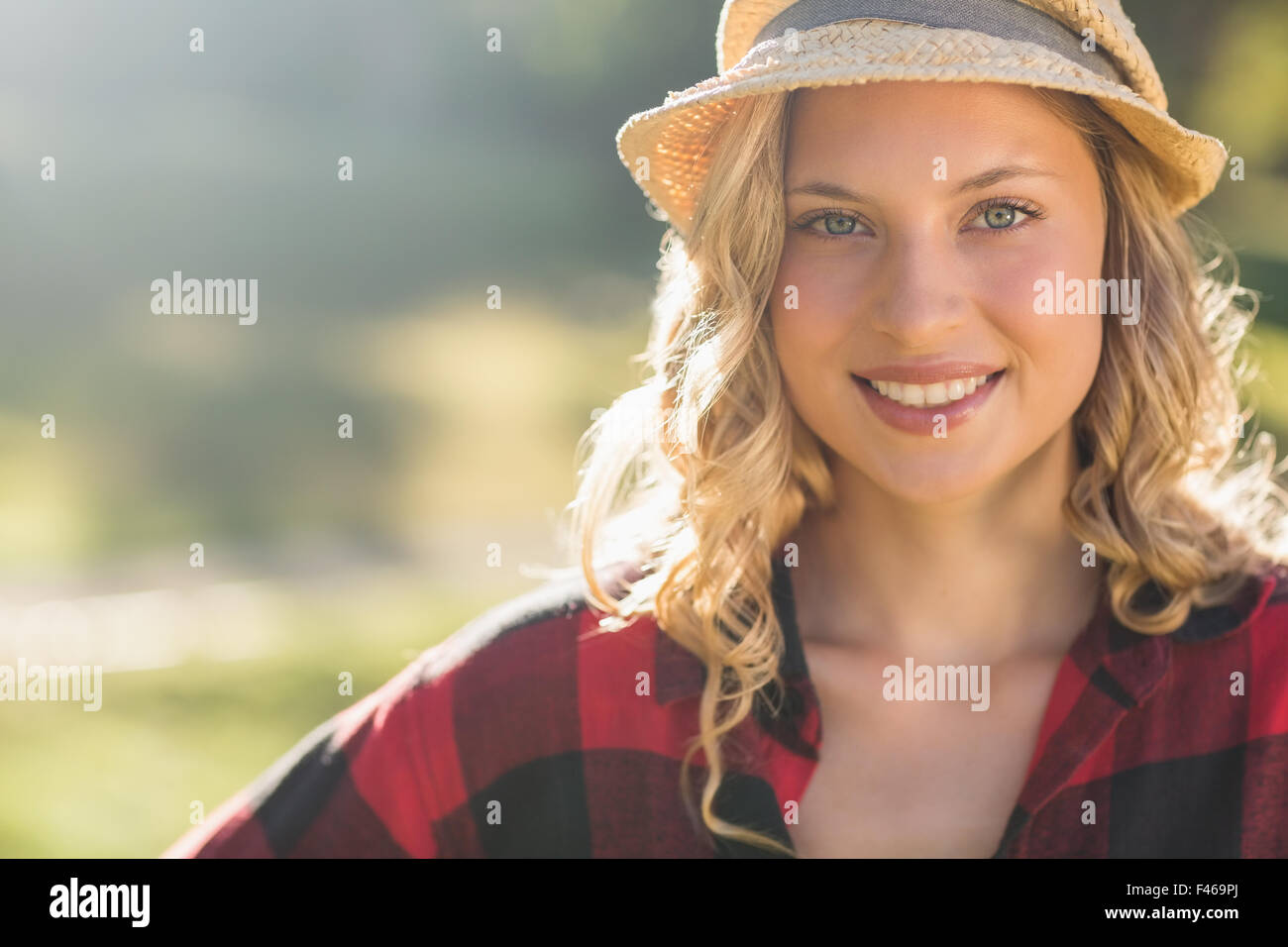 Smiling blonde looking at camera Stock Photo - Alamy