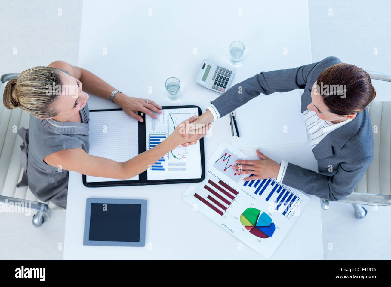 Businesswomen reaching an agreement Stock Photo - Alamy