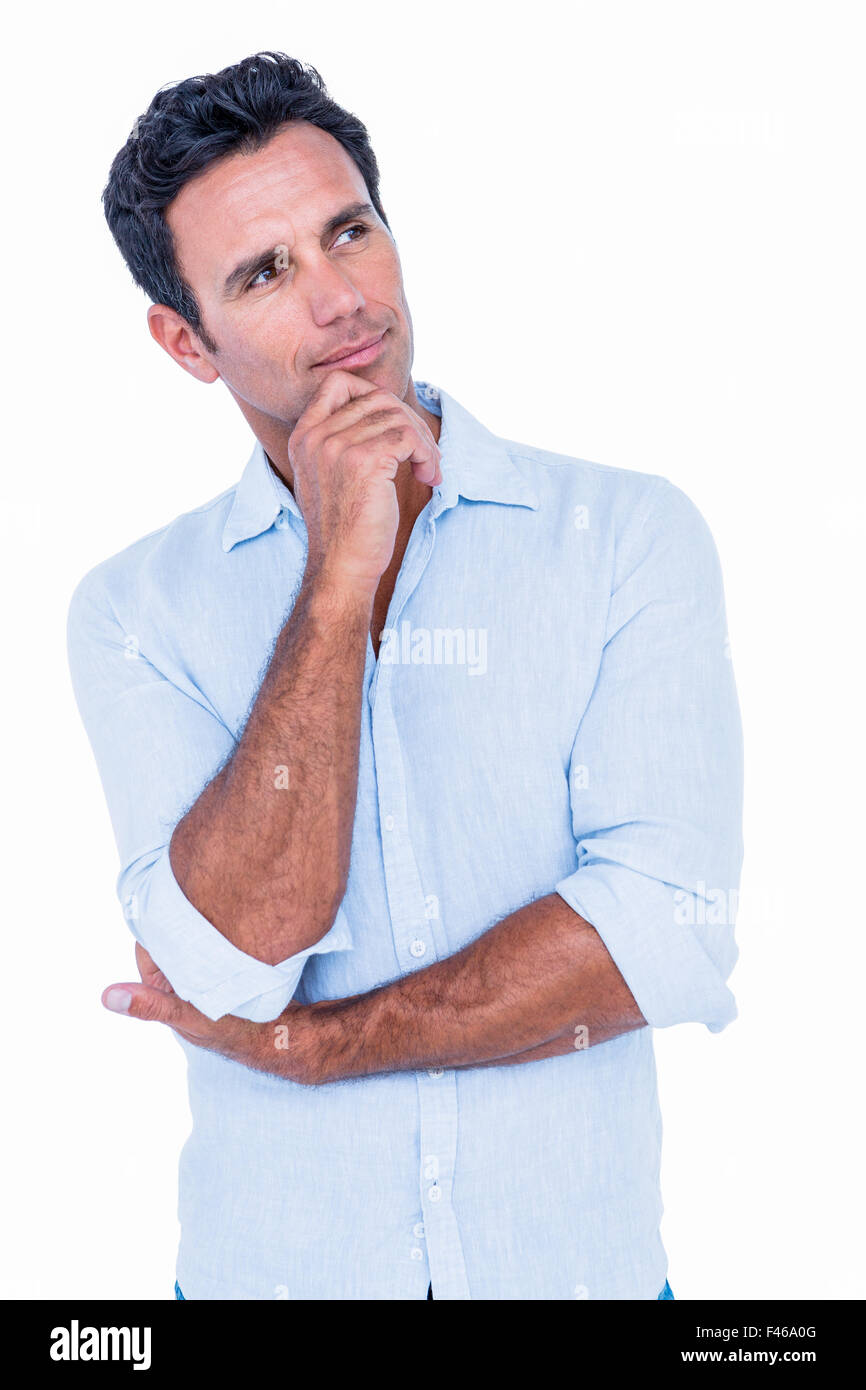 Handsome man thinking with finger on chin Stock Photo - Alamy