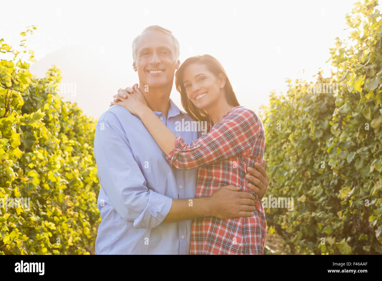 Smiling happy couple embracing Stock Photo - Alamy