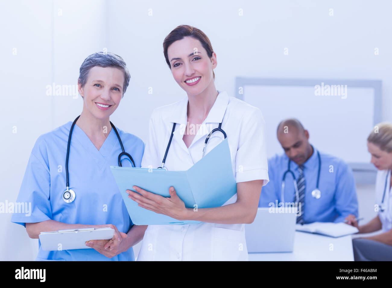 Team of doctors working on their files Stock Photo - Alamy