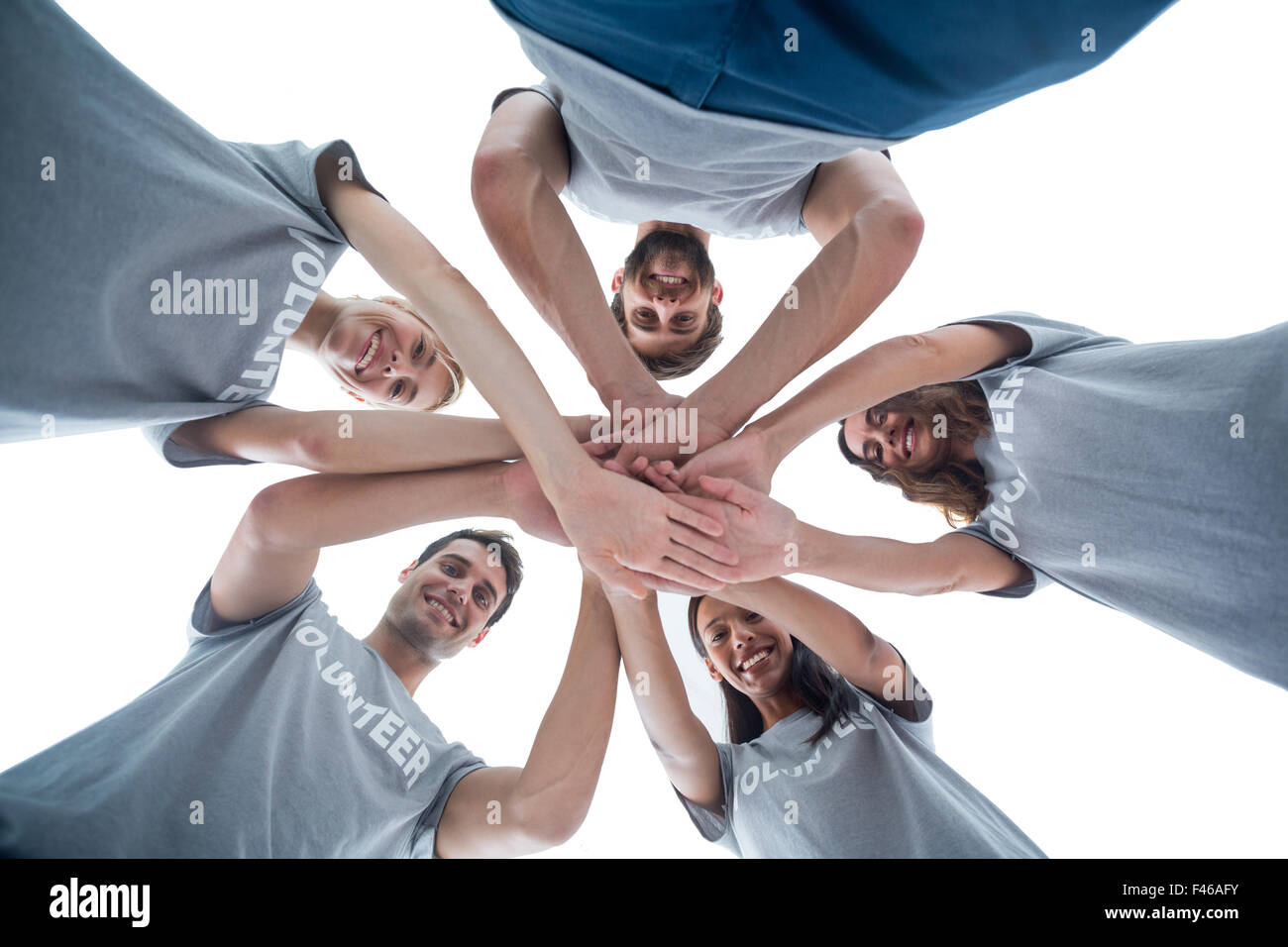 Volunteers putting their hands together Stock Photo - Alamy