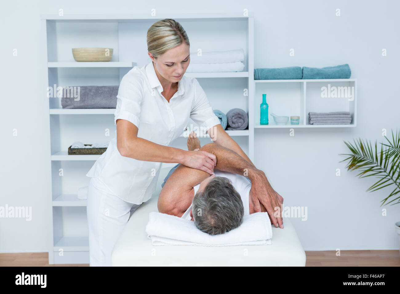 Doctor examining her patient arm Stock Photo - Alamy