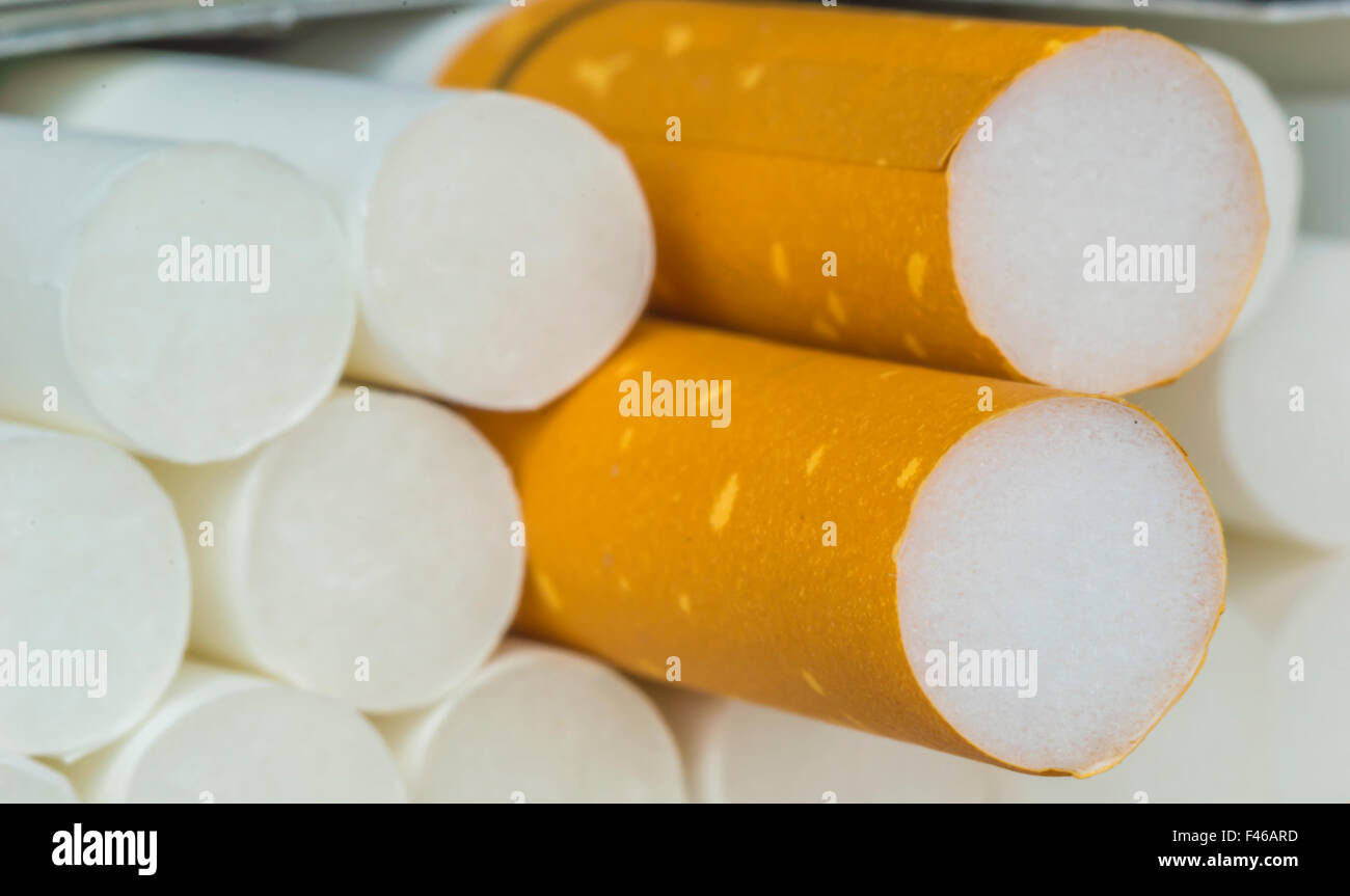Yellow filter cigarette macro Stock Photo - Alamy