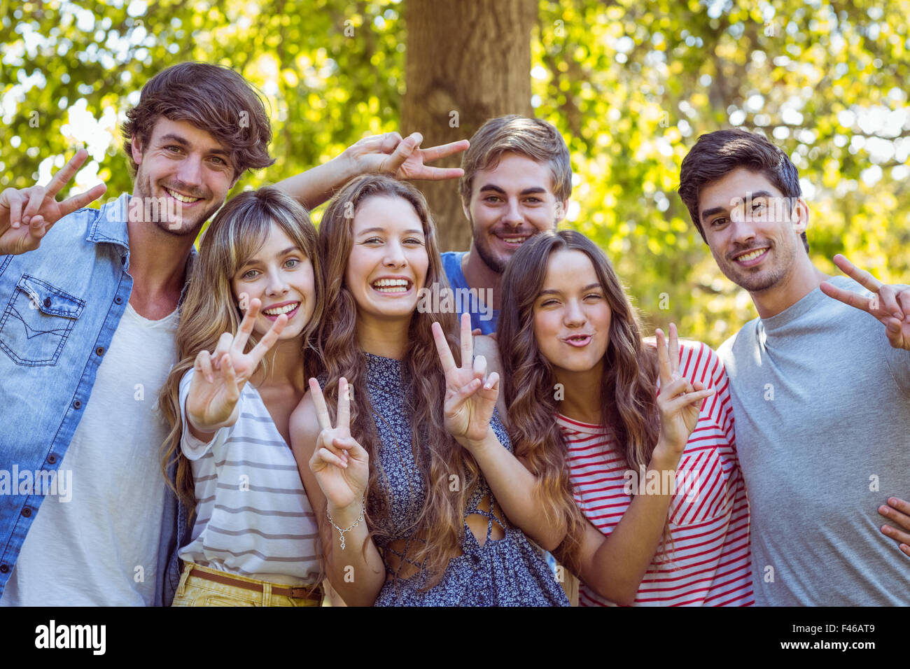 Happy friends in the park Stock Photo - Alamy