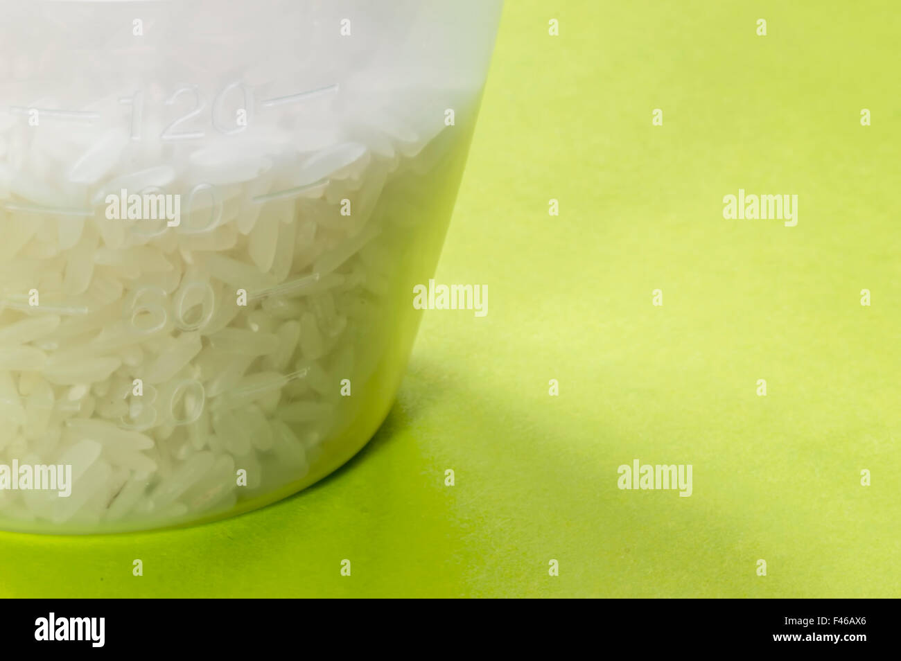 Rice macro with green background Stock Photo - Alamy