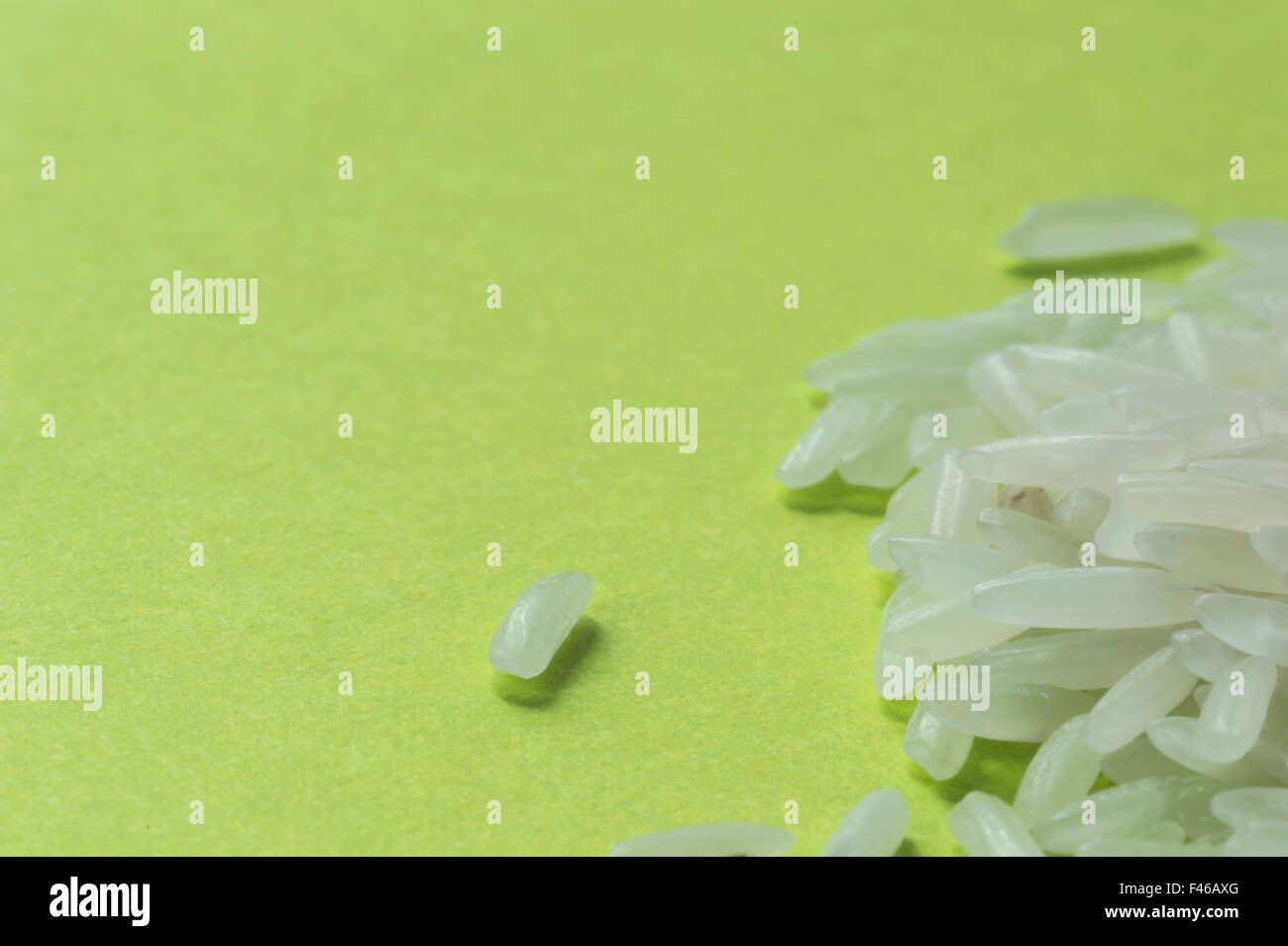 Rice macro with green background Stock Photo - Alamy