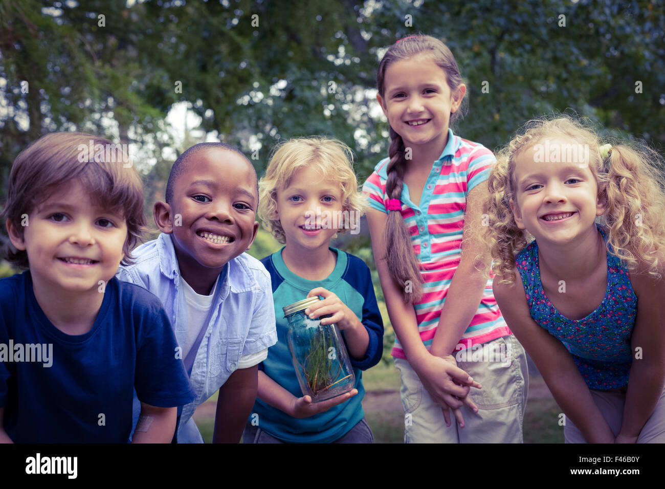 Smiling children looking down the camera Stock Photo - Alamy