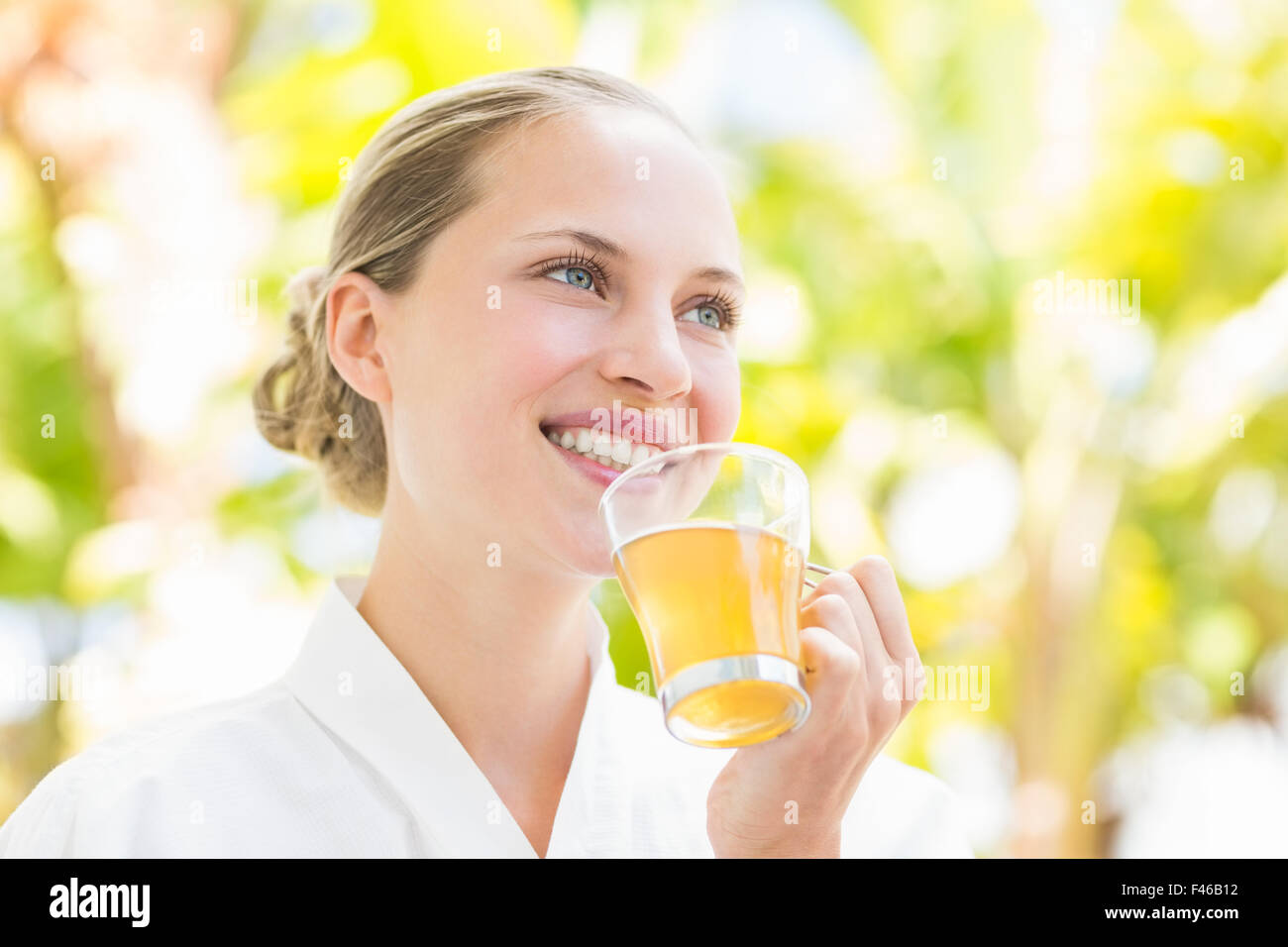 Attractive woman drinking tea Stock Photo - Alamy