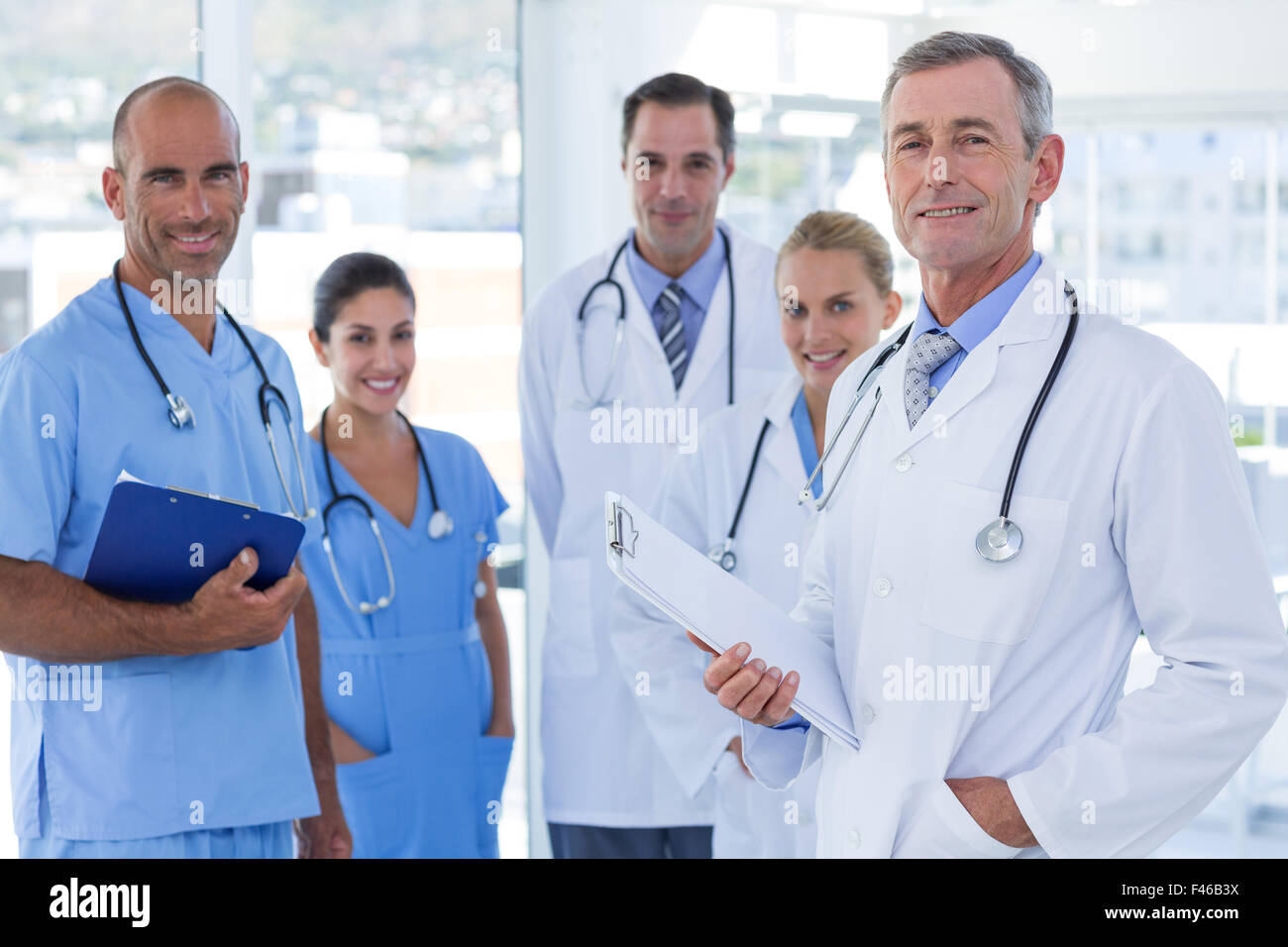 Team of smiling doctors looking at camera Stock Photo - Alamy