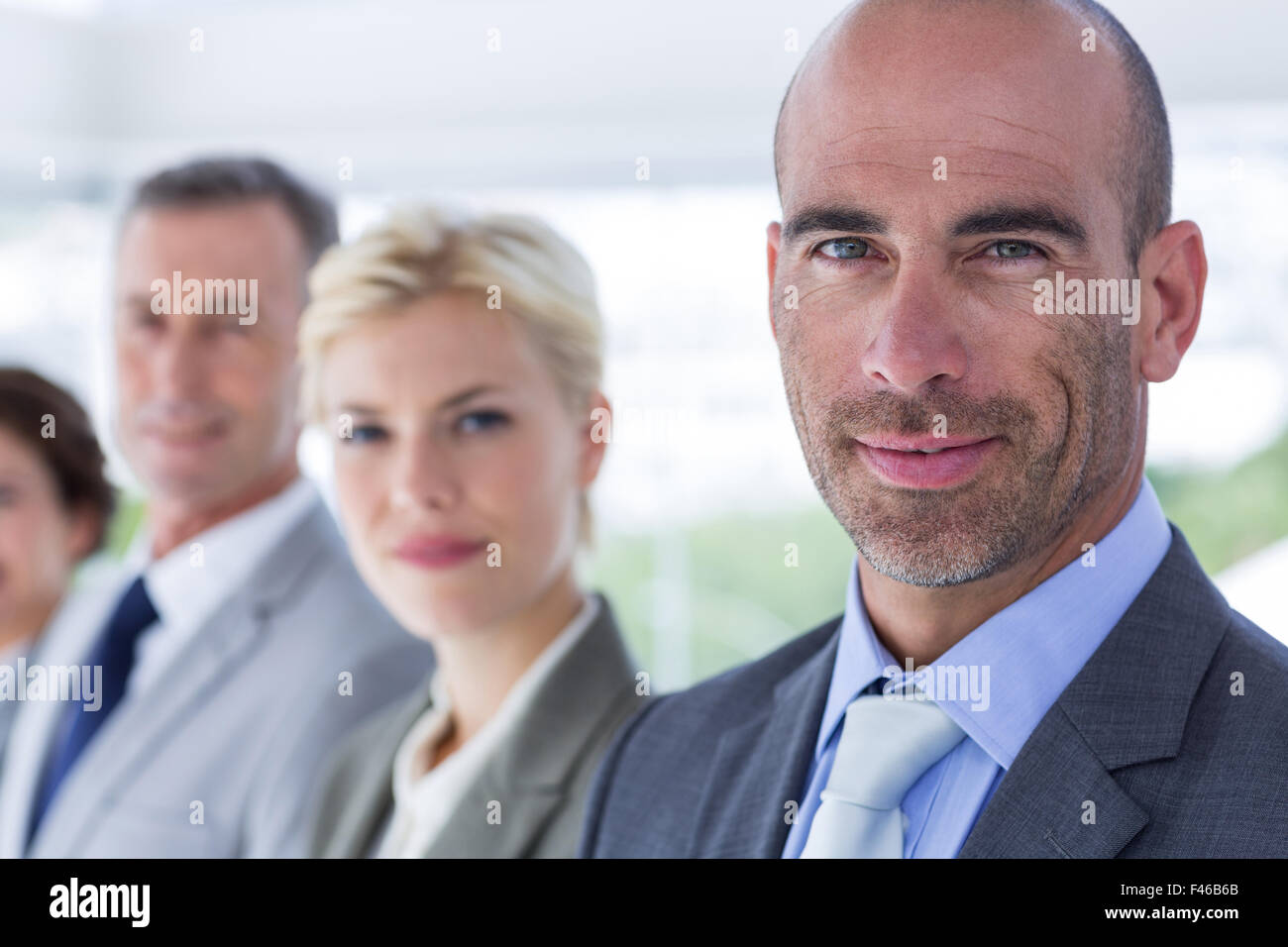 Business people looking at camera Stock Photo - Alamy