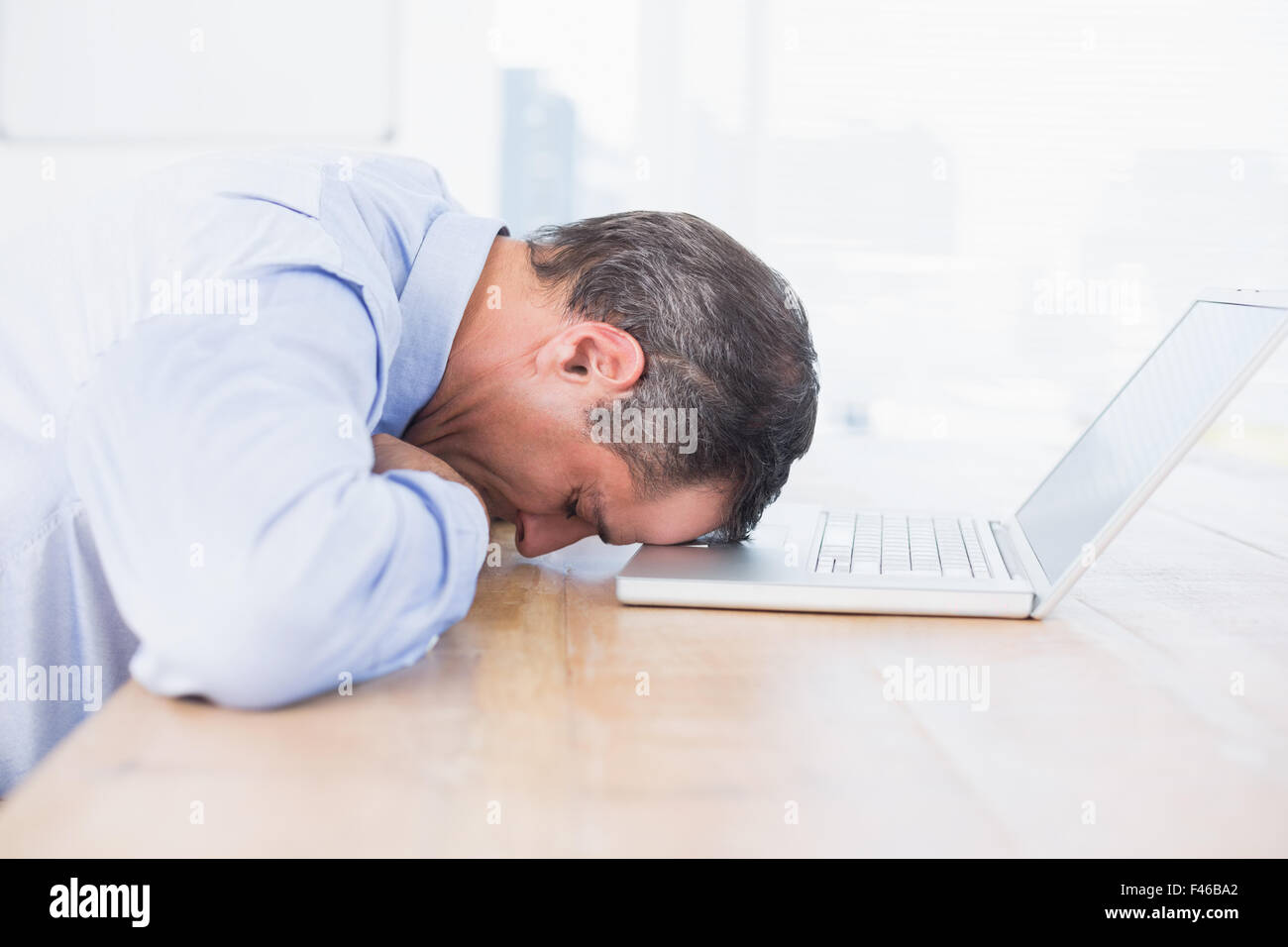 Sleeping businessman in his office Stock Photo - Alamy