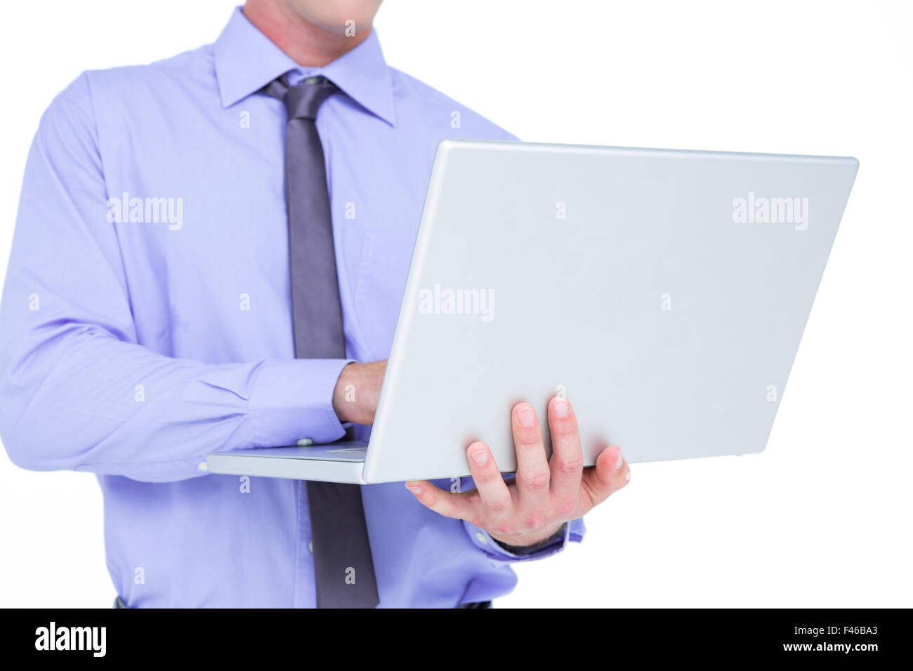 Businessman using a laptop Stock Photo - Alamy