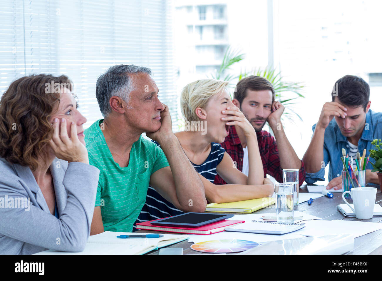 Exhausted business team in office Stock Photo - Alamy