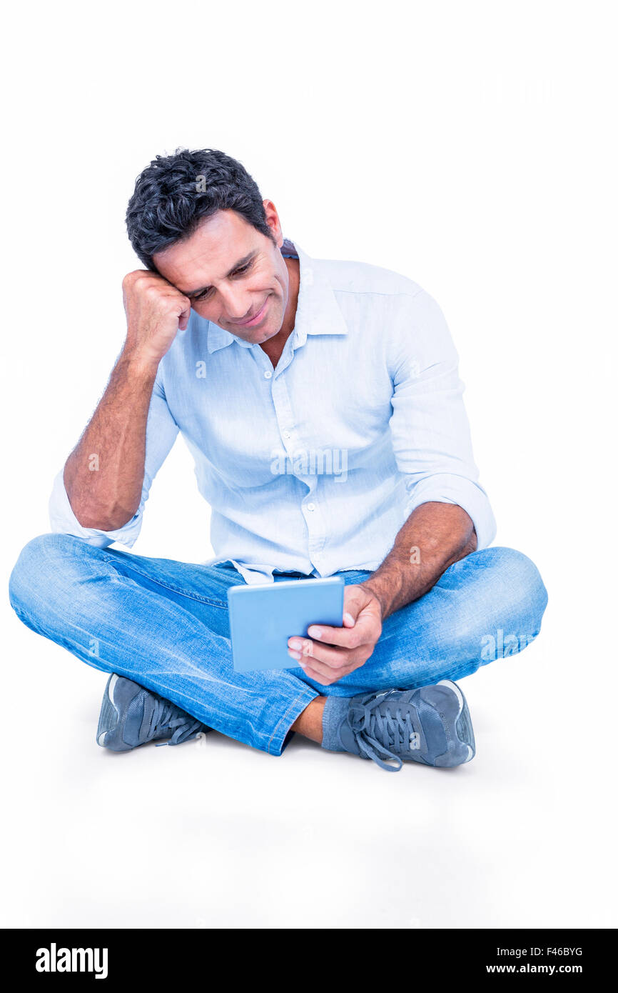 Handsome man using tablet computer Stock Photo - Alamy