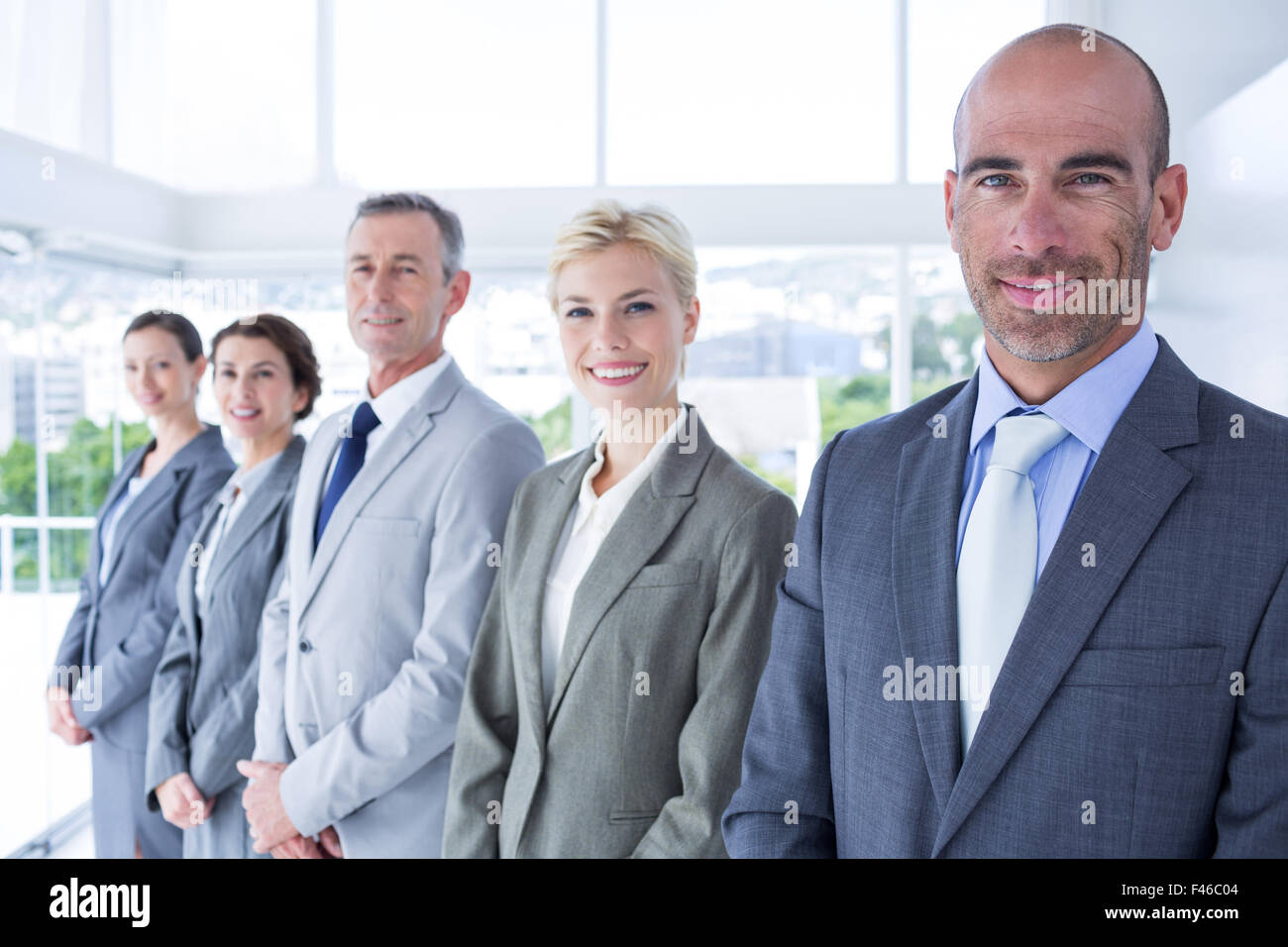 Business colleagues looking at camera Stock Photo - Alamy