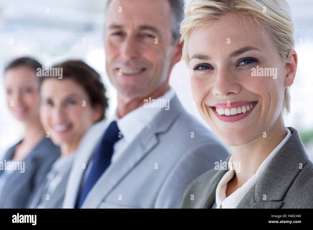 Business people looking at camera Stock Photo - Alamy