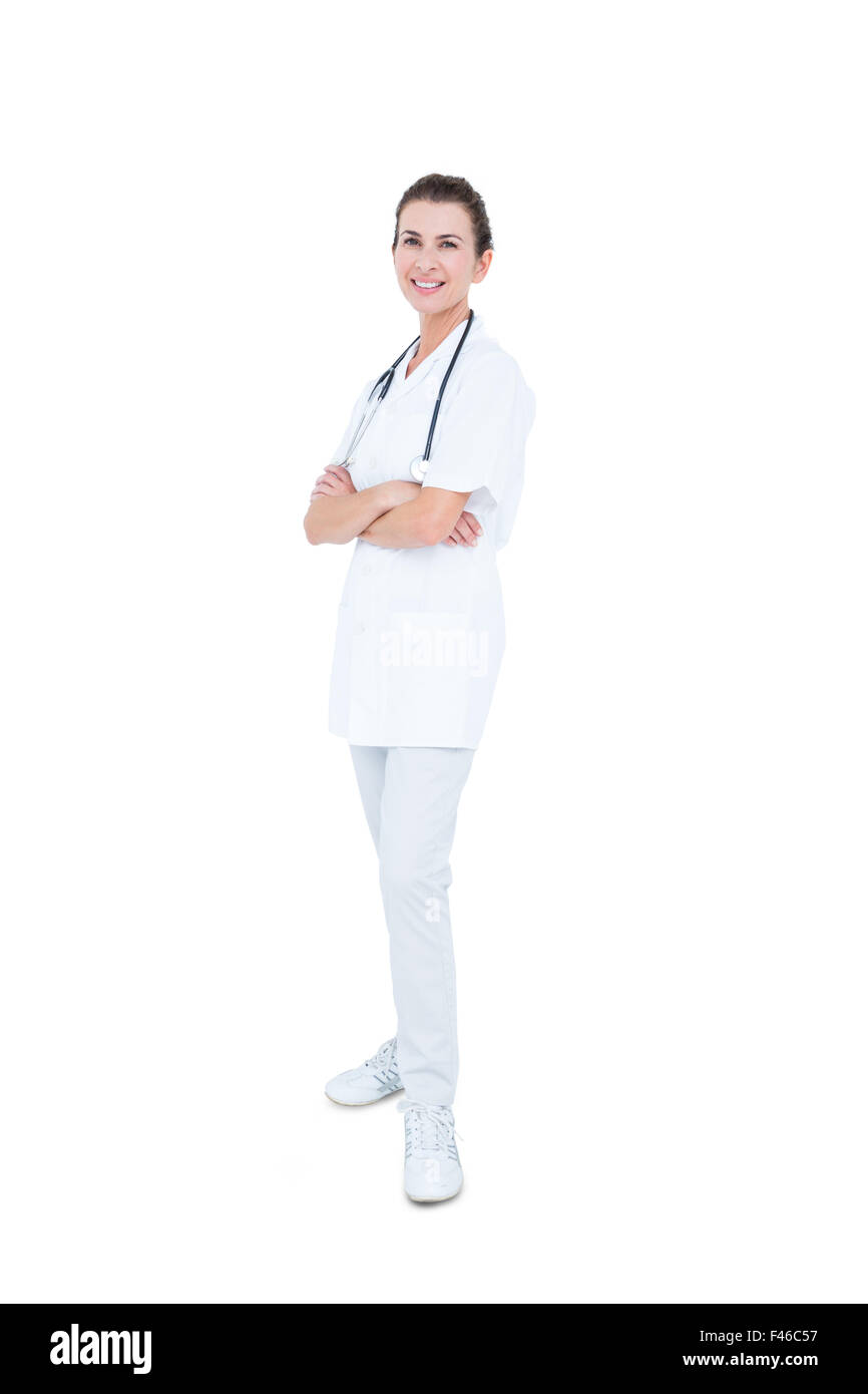 Female doctor folding arms Stock Photo - Alamy