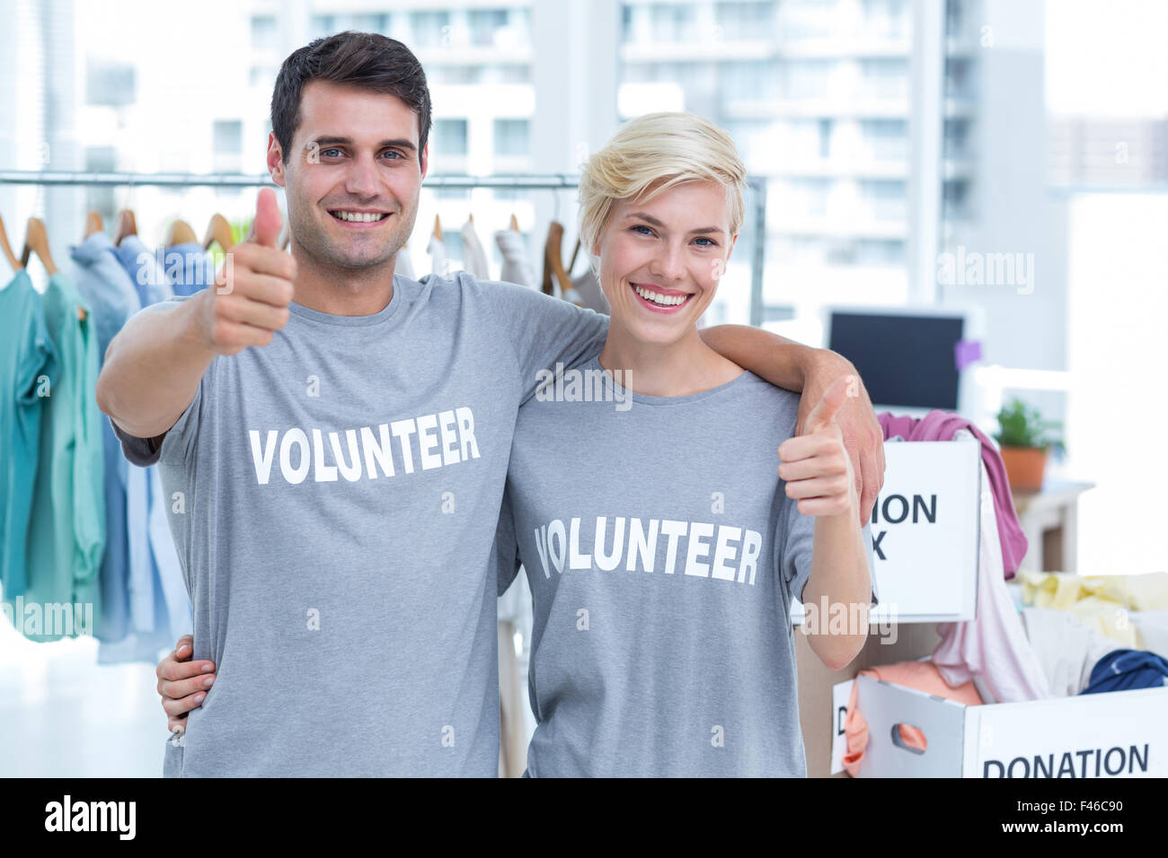 Happy couple of volunteer Stock Photo - Alamy