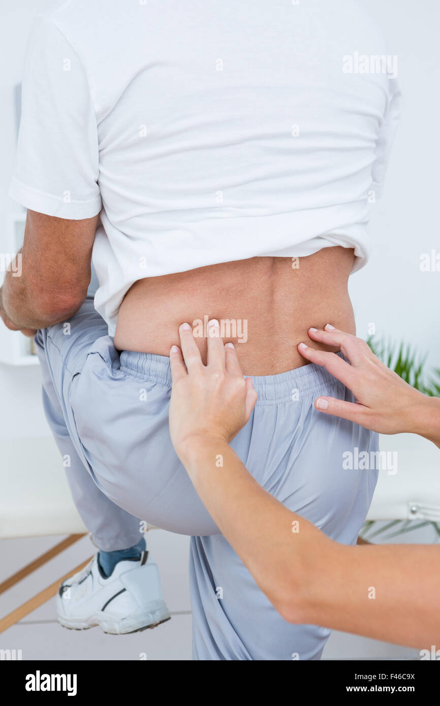 Doctor examining her patient back Stock Photo - Alamy