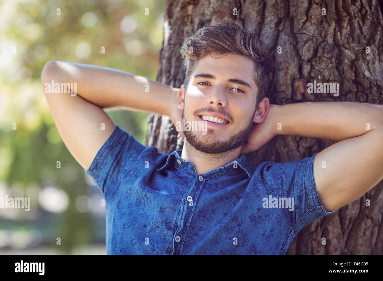 Handsome hipster smiling at camera Stock Photo - Alamy