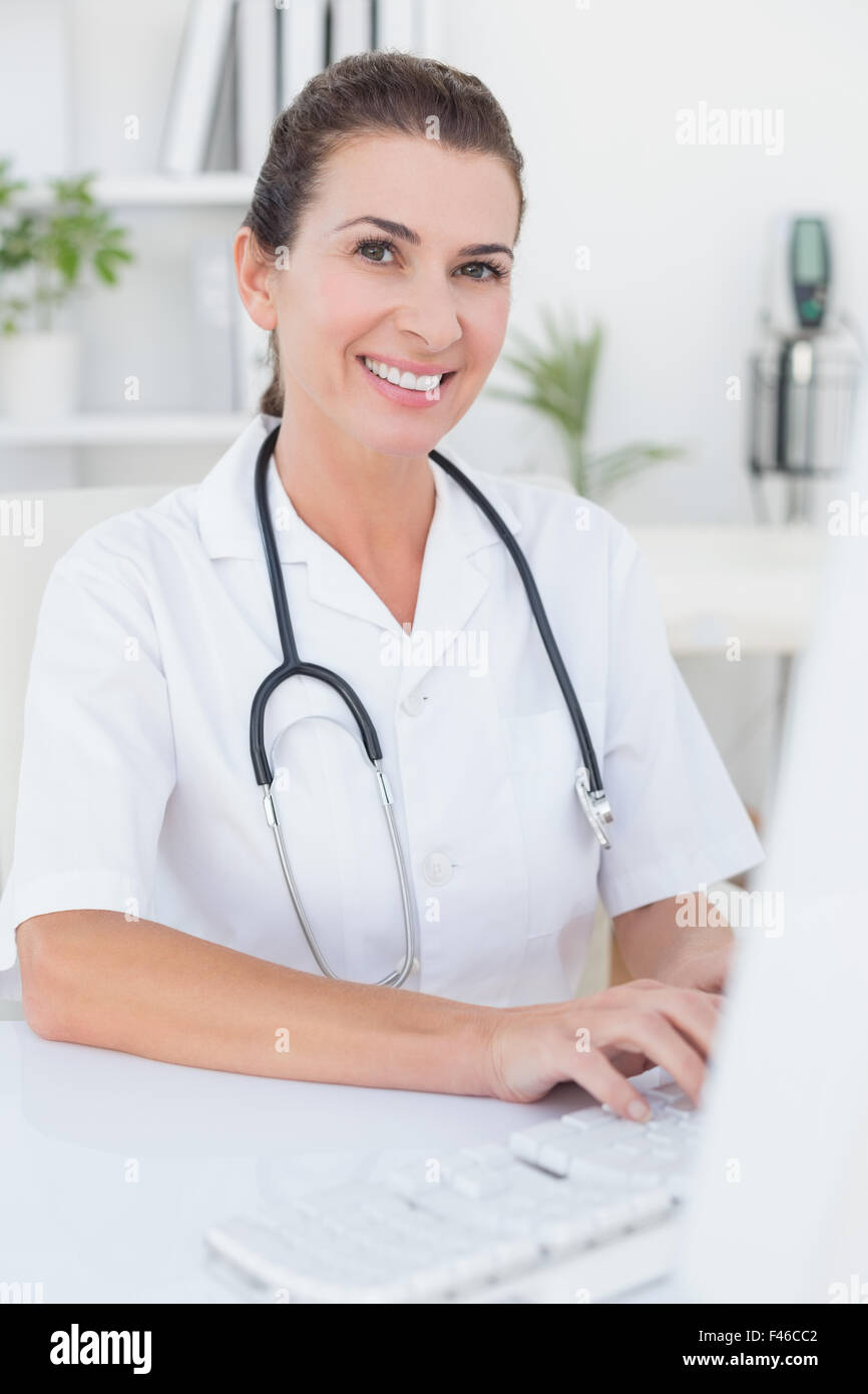 Concentrating doctor using computer Stock Photo - Alamy