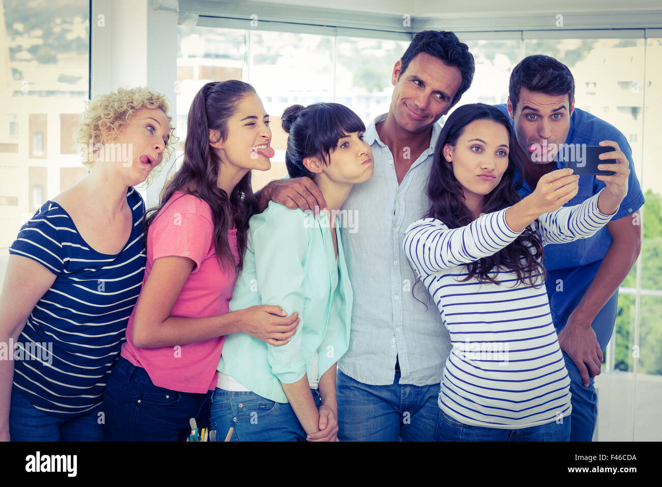 Creative business team taking a selfie Stock Photo - Alamy