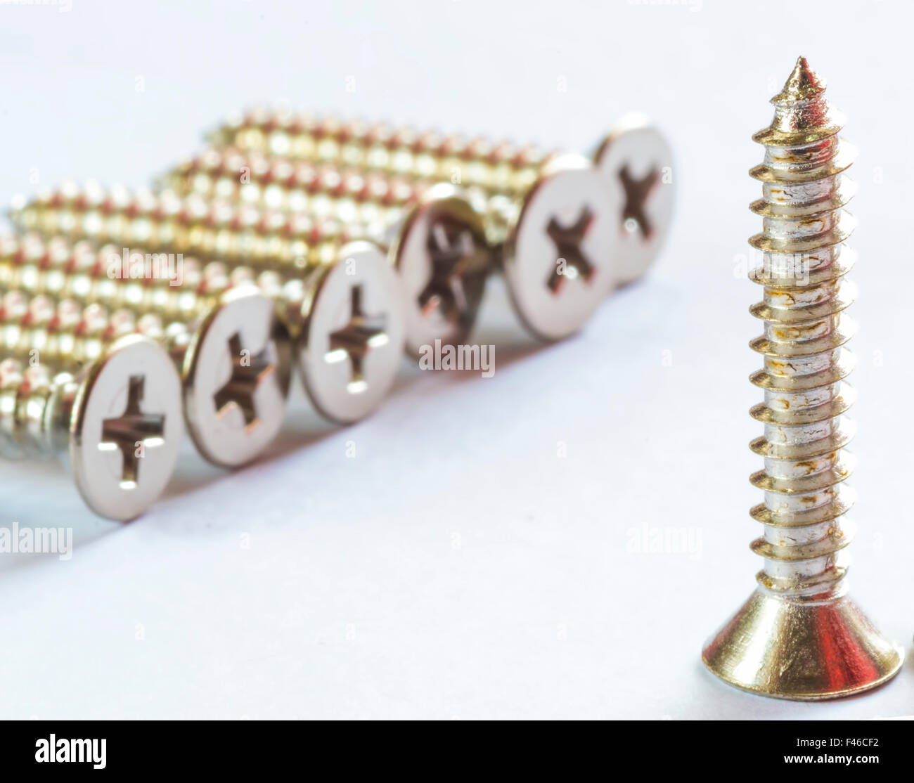 Screws located on a white background Stock Photo - Alamy