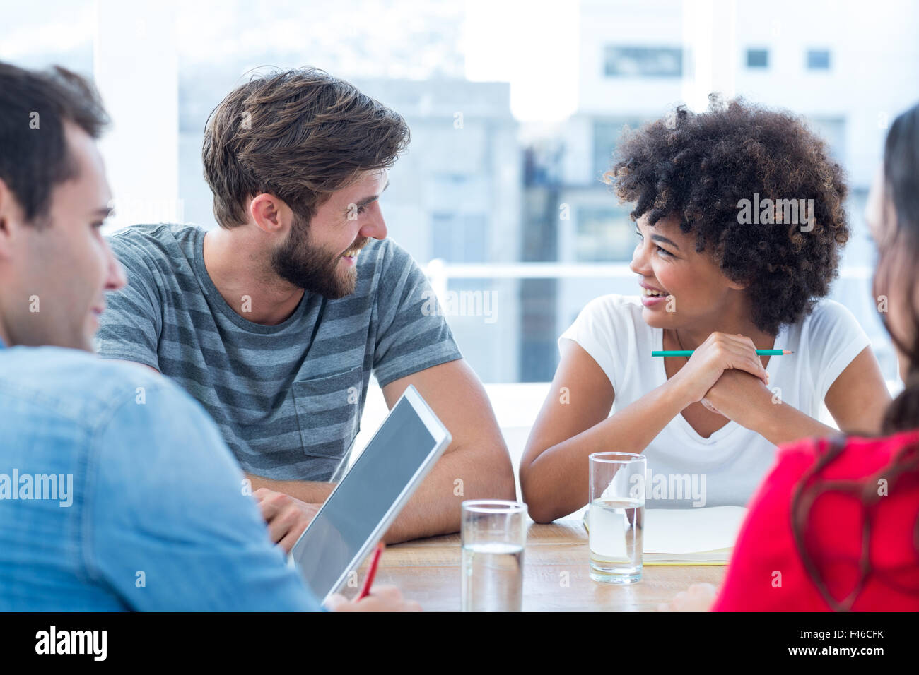 Creative business people in discussion Stock Photo - Alamy