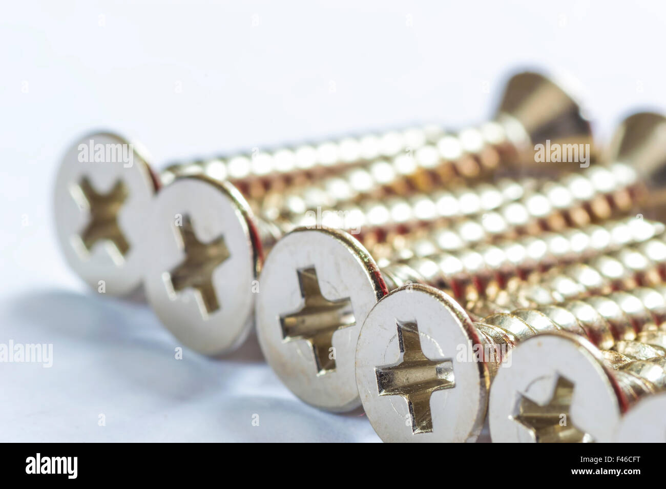 Screws located on a white background Stock Photo - Alamy