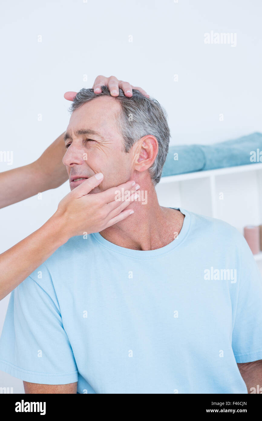 Doctor doing neck adjustment Stock Photo - Alamy
