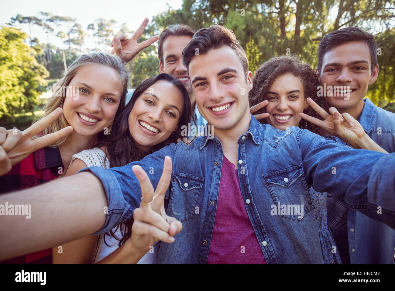 Happy friends smiling at camera Stock Photo - Alamy