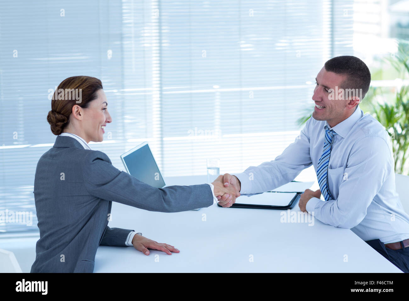 Business partners shaking hand together Stock Photo - Alamy