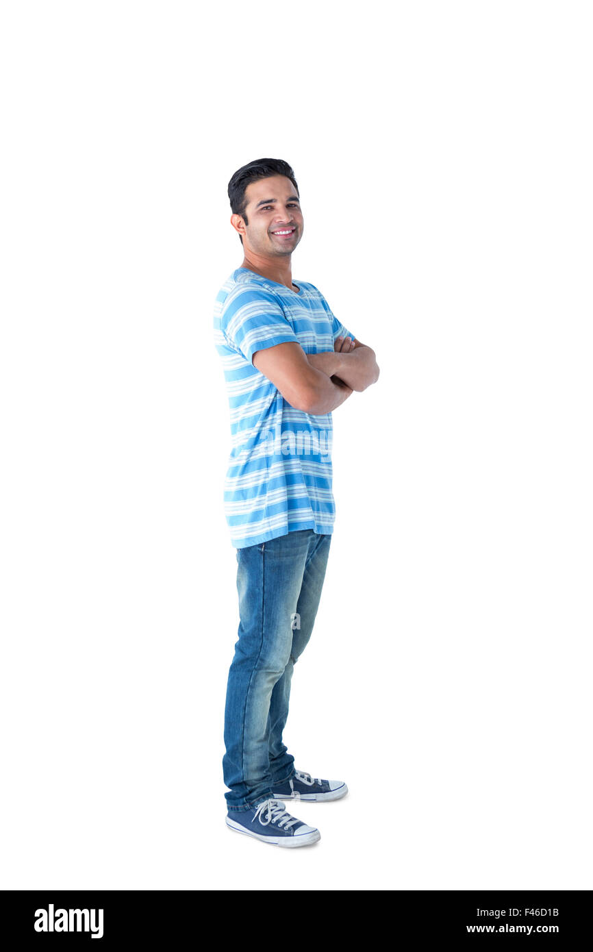 Side view of happy man with arms crossed Stock Photo - Alamy