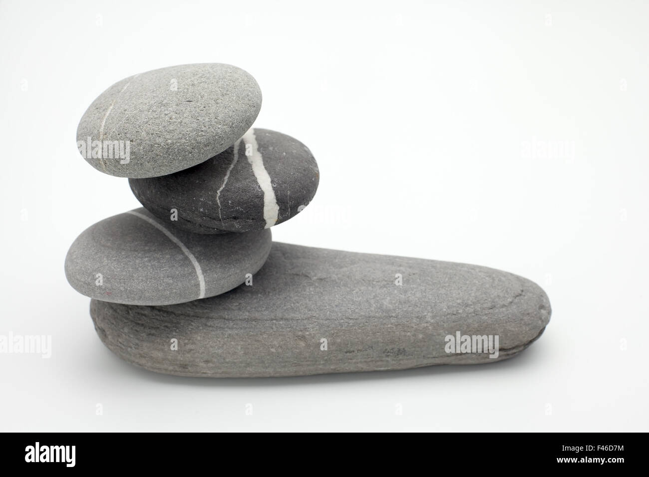 Stone balancing isolated on white background Stock Photo - Alamy