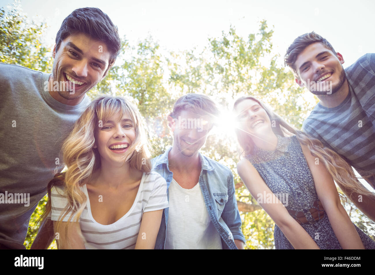 Happy friends in the park Stock Photo - Alamy