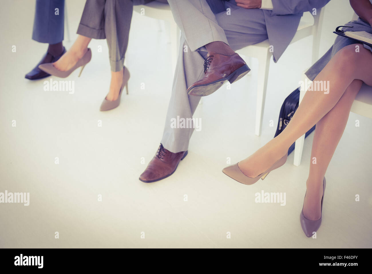 Business people sitting and waiting Stock Photo - Alamy