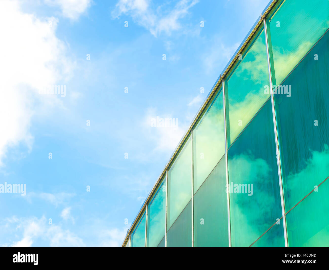 A clouds reflection in glass wall of business building Stock Photo - Alamy